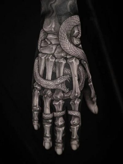 Top 31 Skeleton Hand Tattoo Ideas & Meanings
